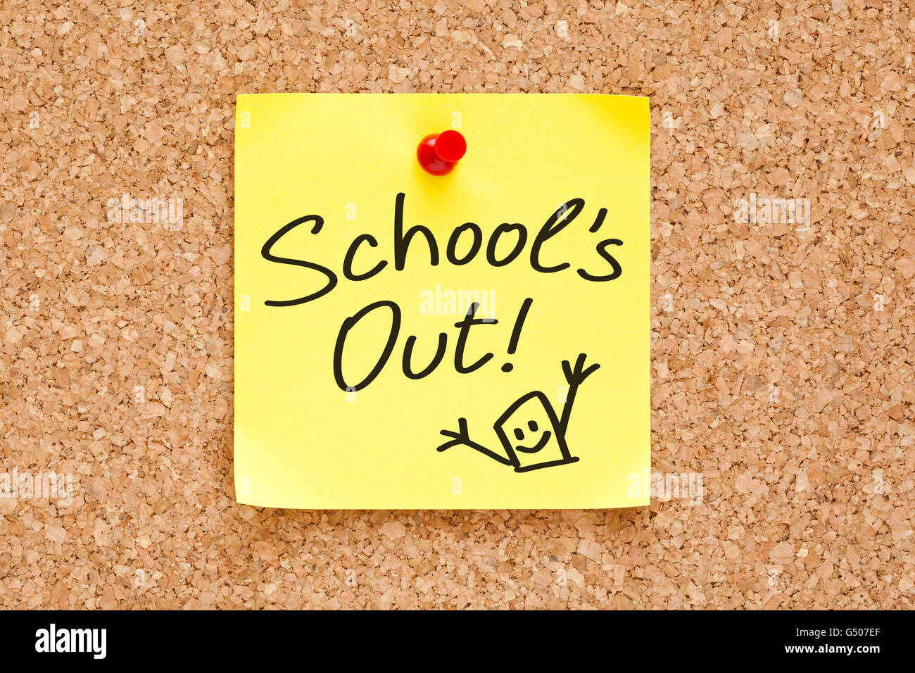 School is Out handwritten on a sticky note pinned on cork bulletin ...