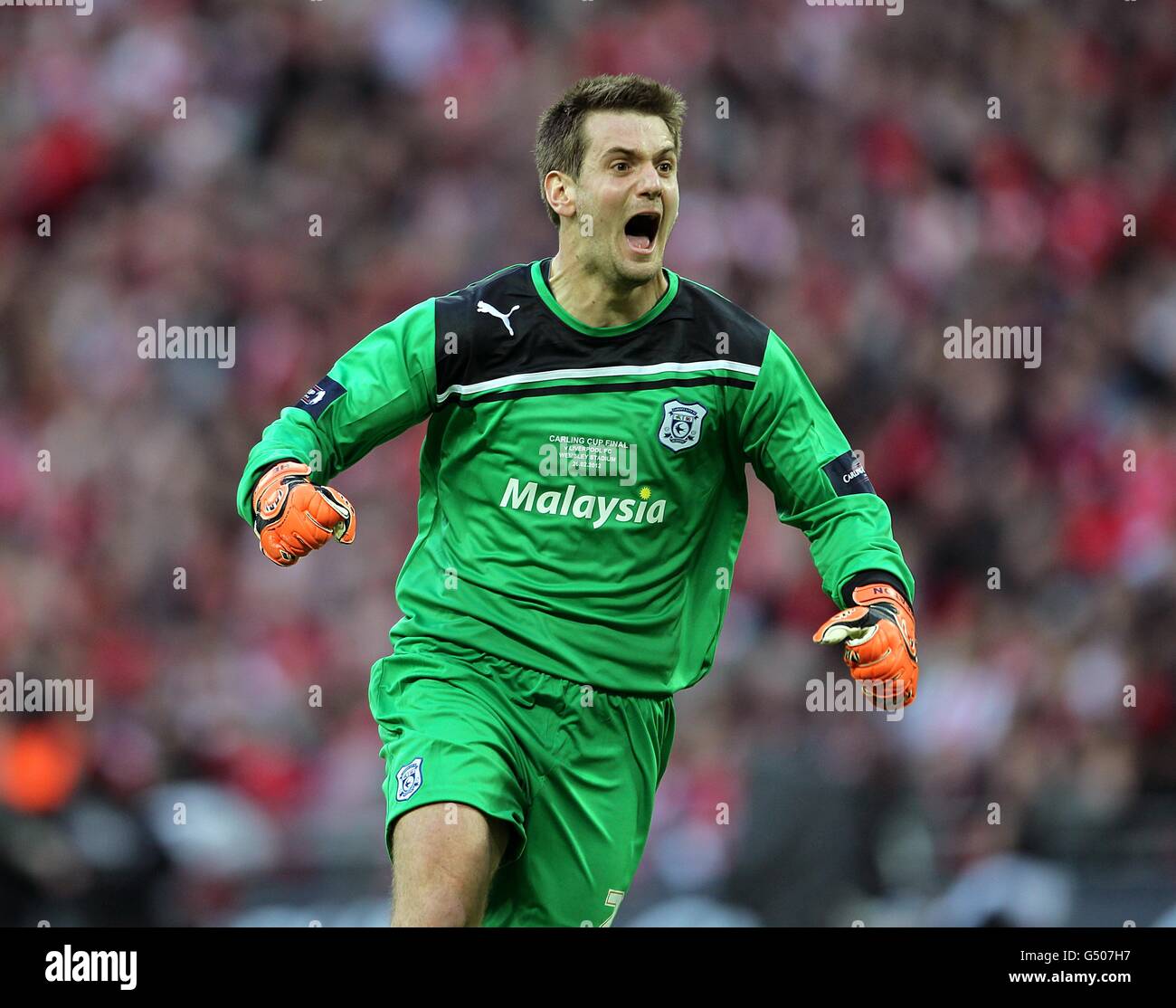 Cardiff City goalkeeper Tom Heaton celebrates after team-mate Joe Mason ...