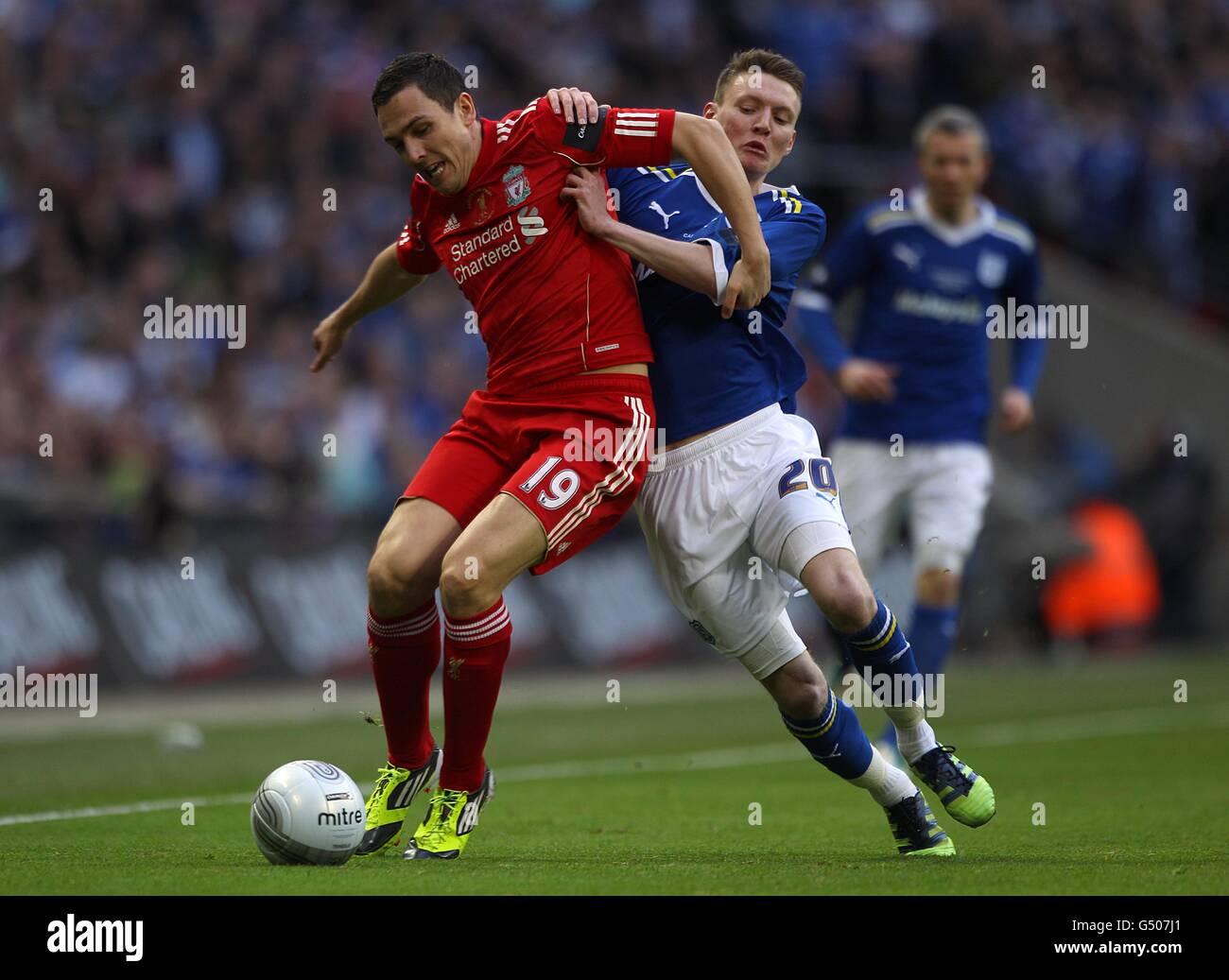 Liverpool's Stewart Downing (left) and Cardiff City's Joe Mason battle ...