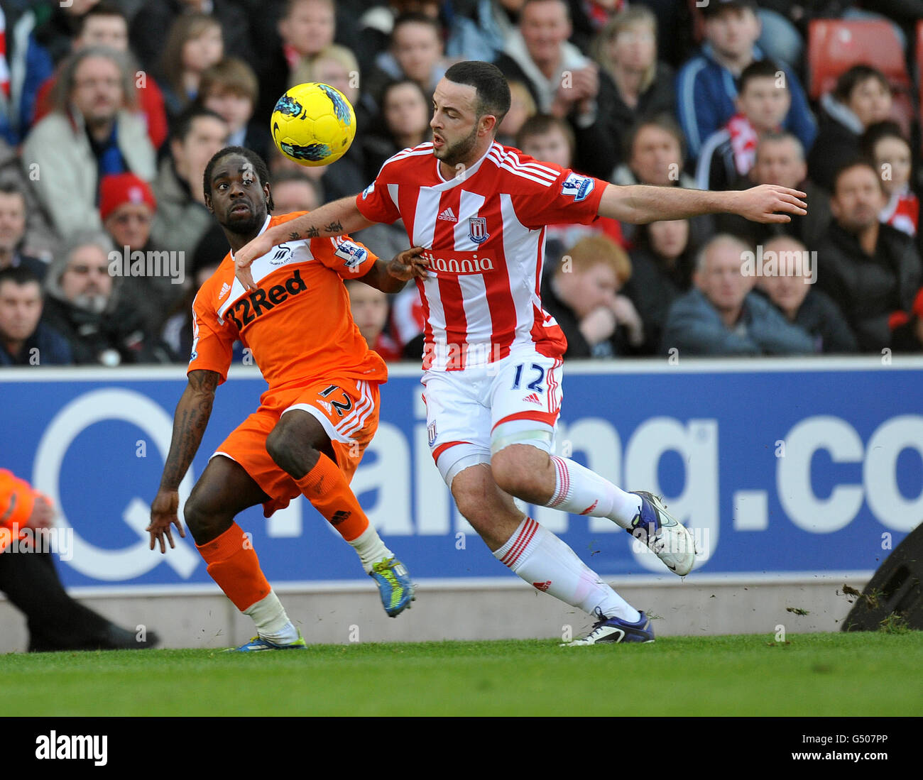 Stoke City's Mark Wilson holds off Swansea City's Nathan Dyer (left ...