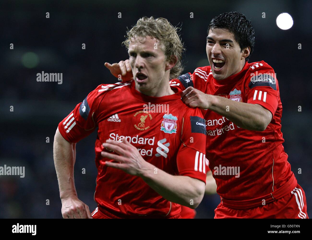 Liverpool's Dirk Kuyt celebrates scoring his side's second goal with ...