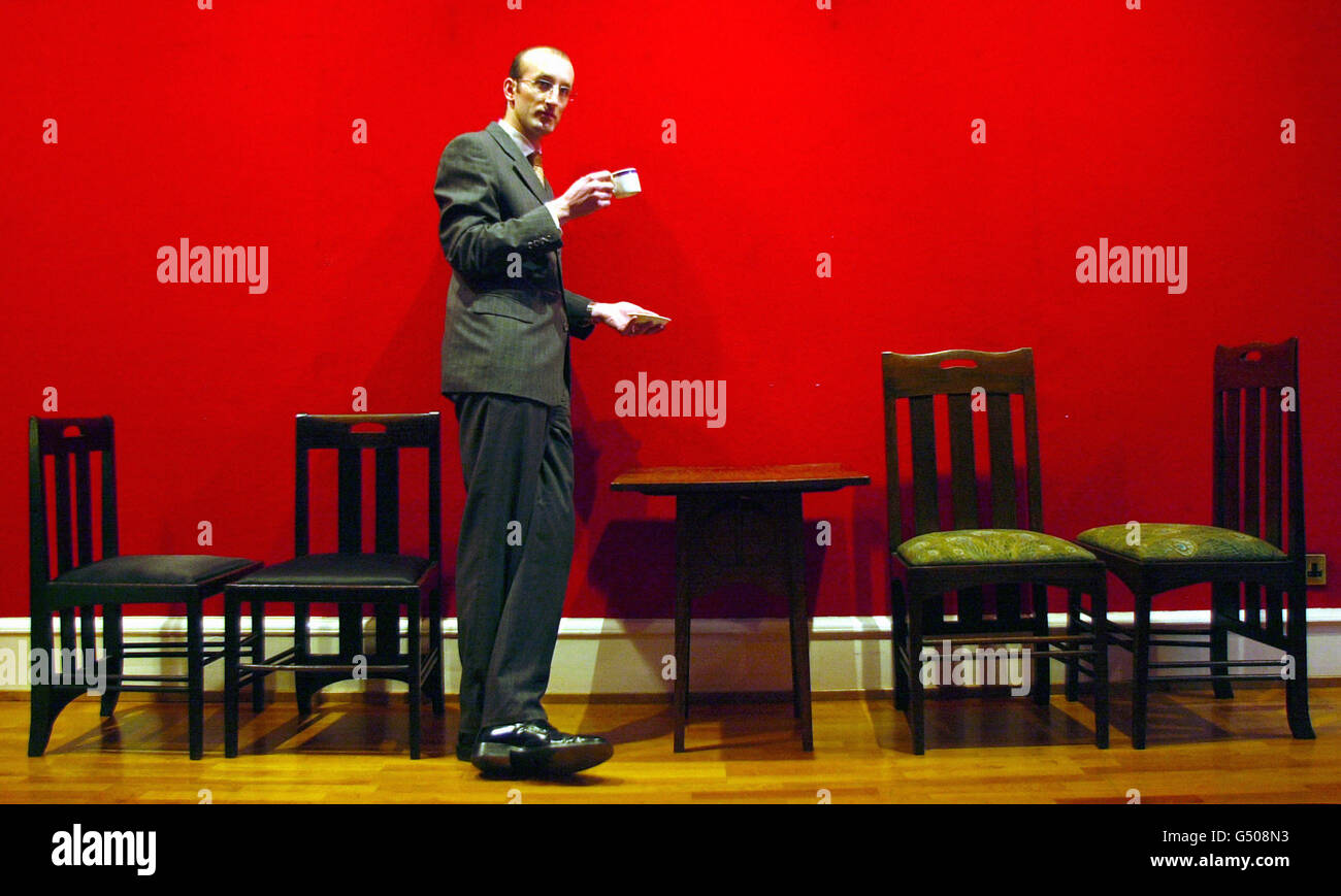 Gavin Strang, of Christie's Auction House in Glasgow, with two pairs of ...