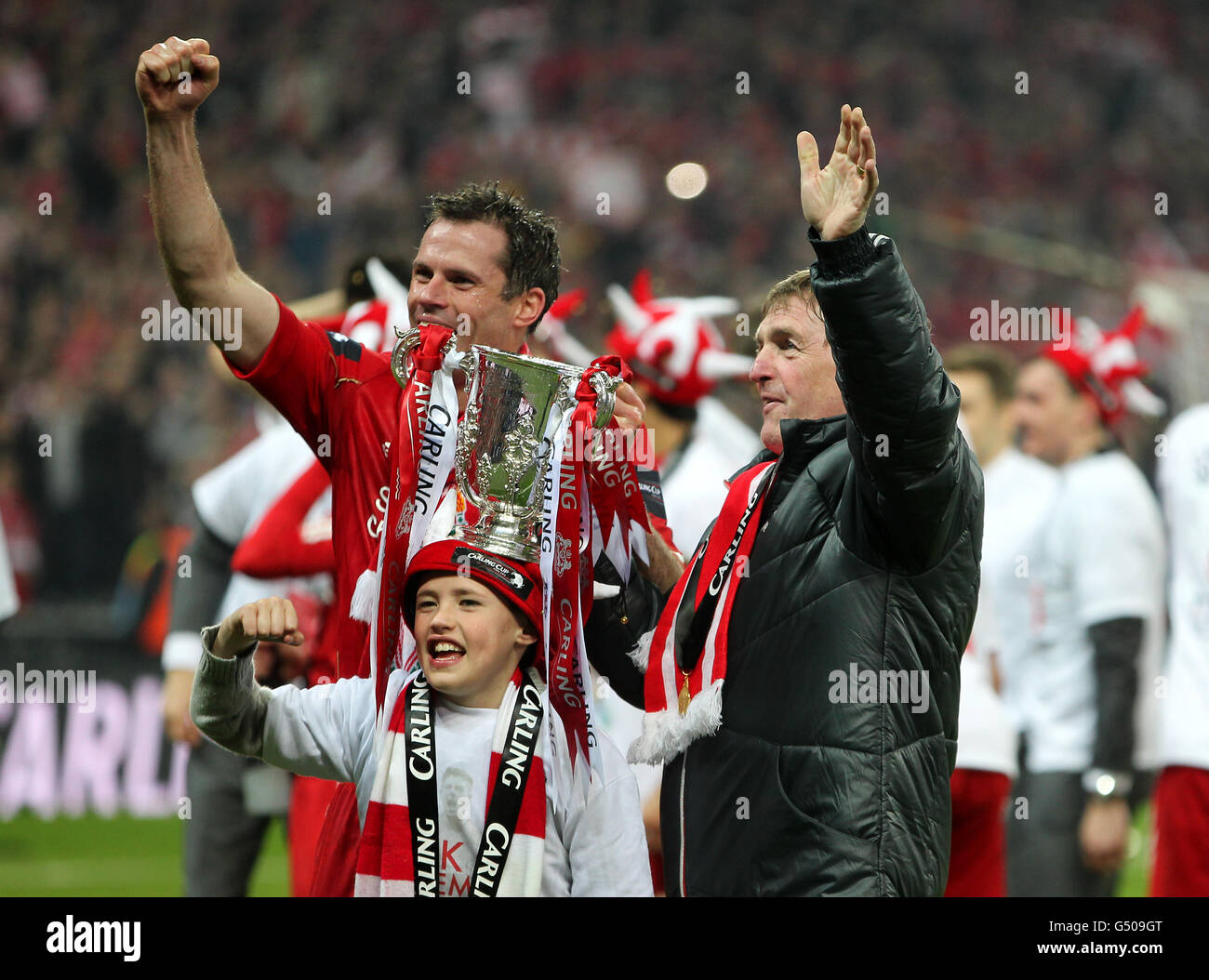 Liverpool's Jamie Carragher (left) and his son james with manager Kenny ...