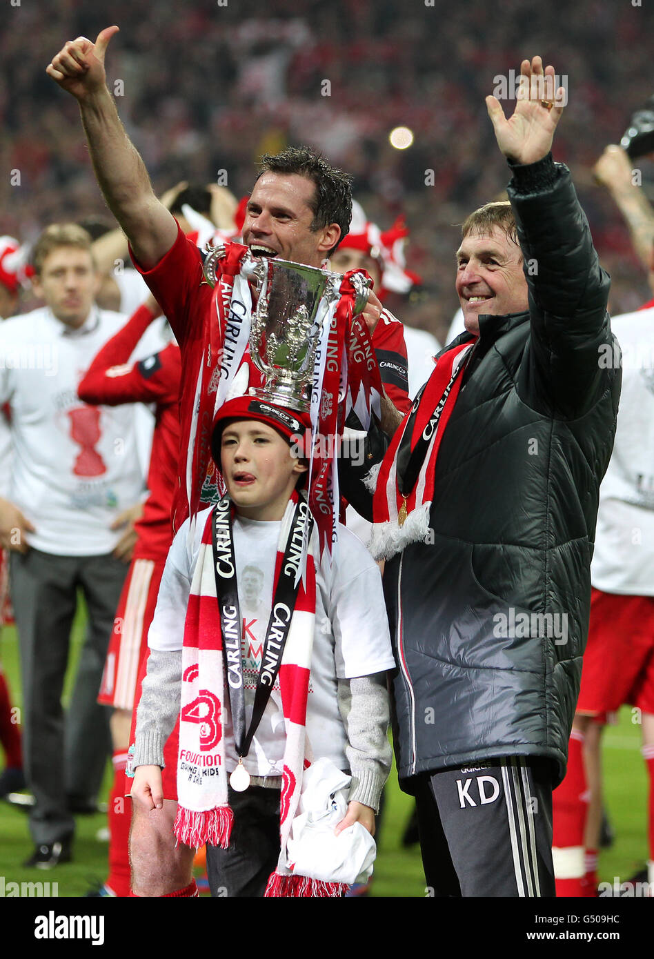 Liverpool's Jamie Carragher (left) and his son James with manager Kenny ...