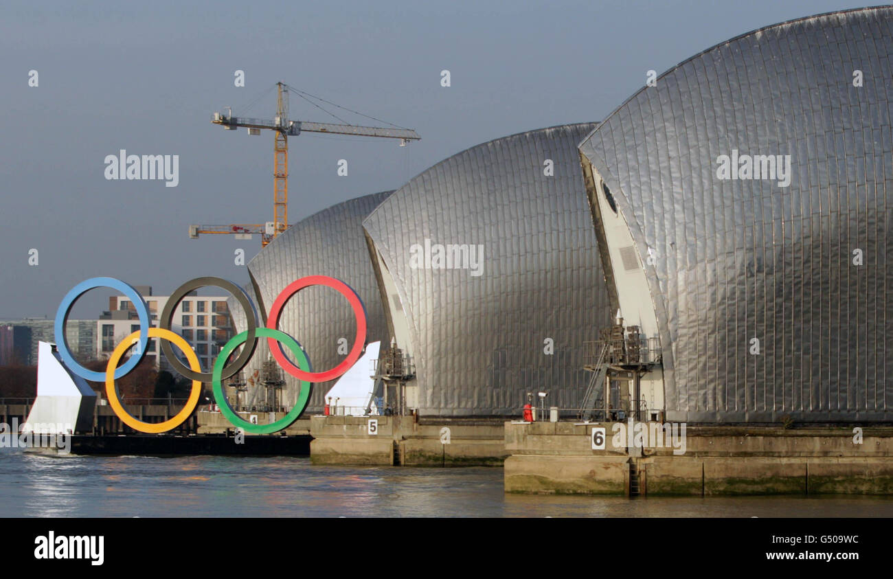 Giant Olympic rings pass the Thames Barrier, as they were launched on ...