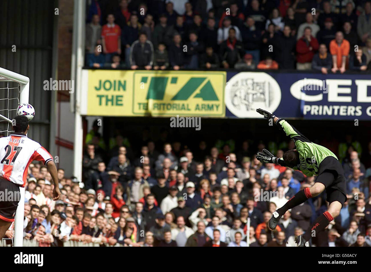 Southampton's goalkeeper Neil Moss attempts to save Manchester United's ...