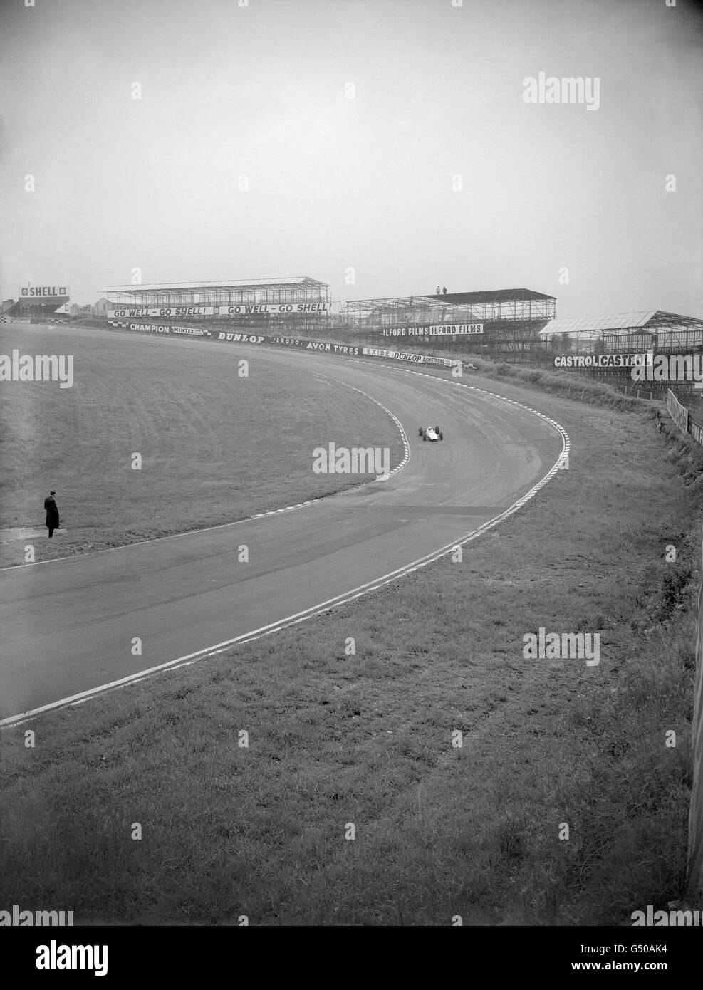 A car drives through Paddock Hill Bend on the Brands Hatch circuit. The ...