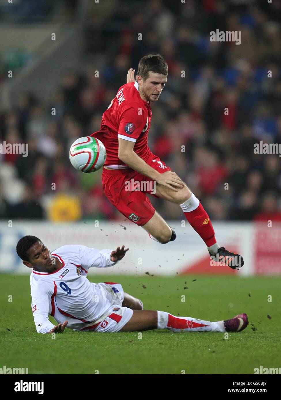 Wales' Adam Matthews (right) and Costa Rica's Kenny Cunningham battle ...