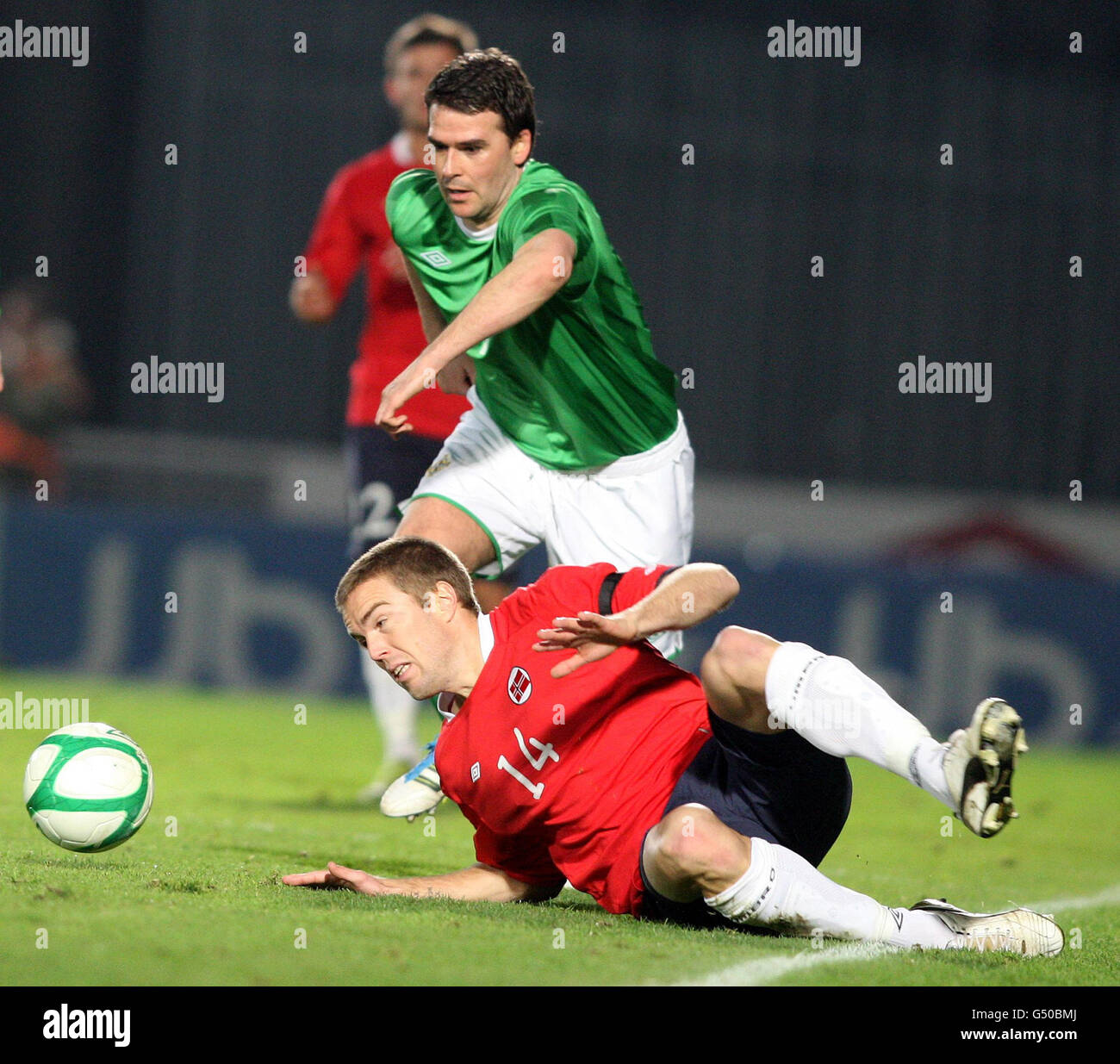 Northern Ireland David Healy and Norway's Espen Rudd (floor) battle for ...