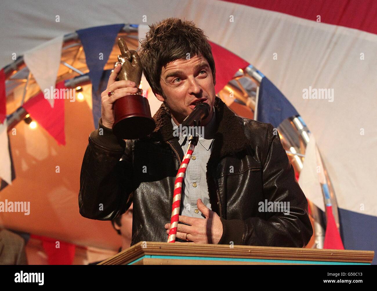 Noel Gallagher collects the Godlike Genius Award on stage during the ...