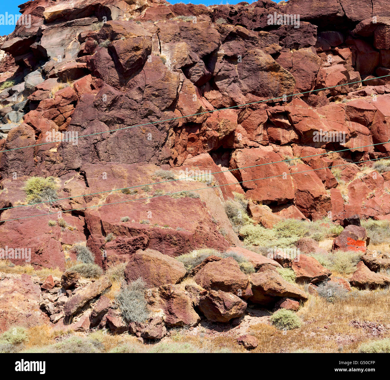 santorini europe greece and dry bush rock alone in the sky Stock Photo ...