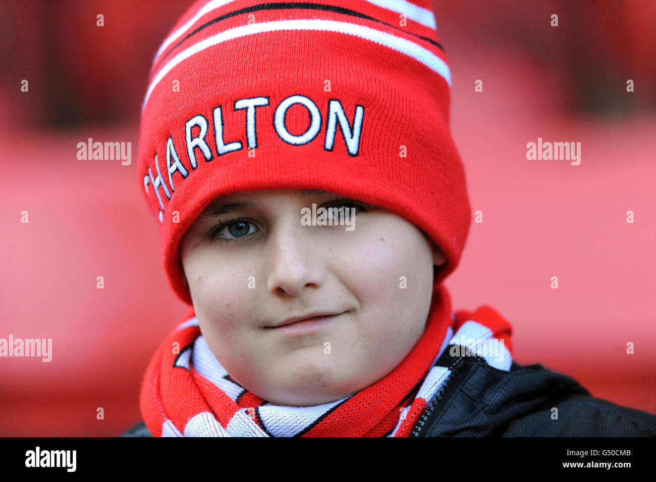 A young Charlton Athletic fan shows his support in the stands Stock ...