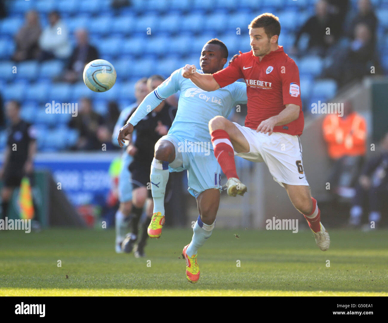 Coventry citys alex nimely and barnsleys stephen foster hi-res stock ...