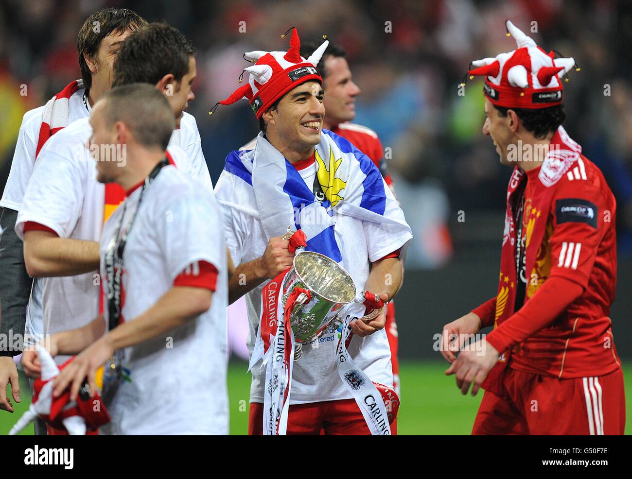 Liverpools luis suarez celebrates with the carling cup trophy hi-res ...