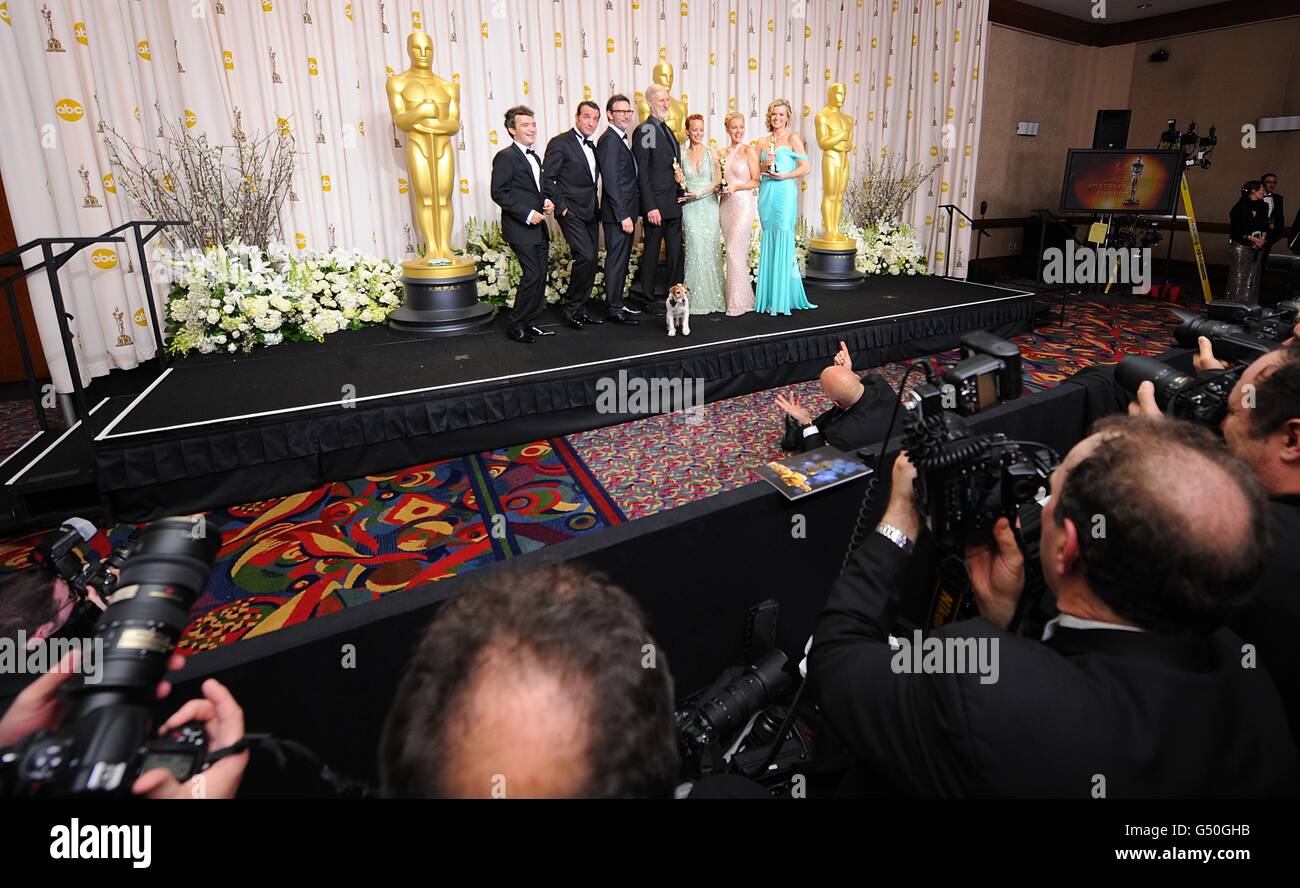 Cast and crew member of The Artist with their awards at the 84th ...