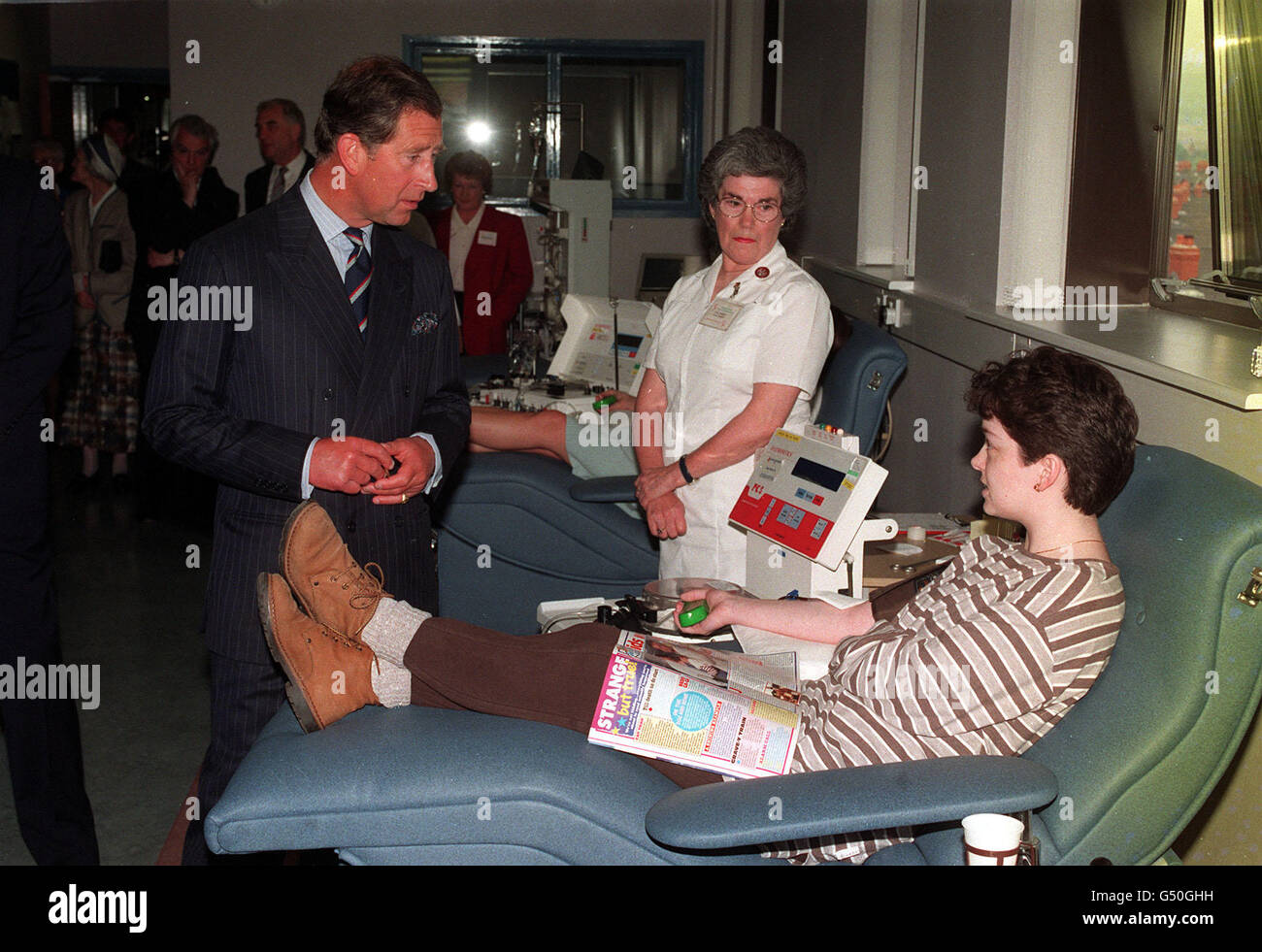 The Prince of Wales has a joke with Mrs Susan Logan, as she gave blood ...