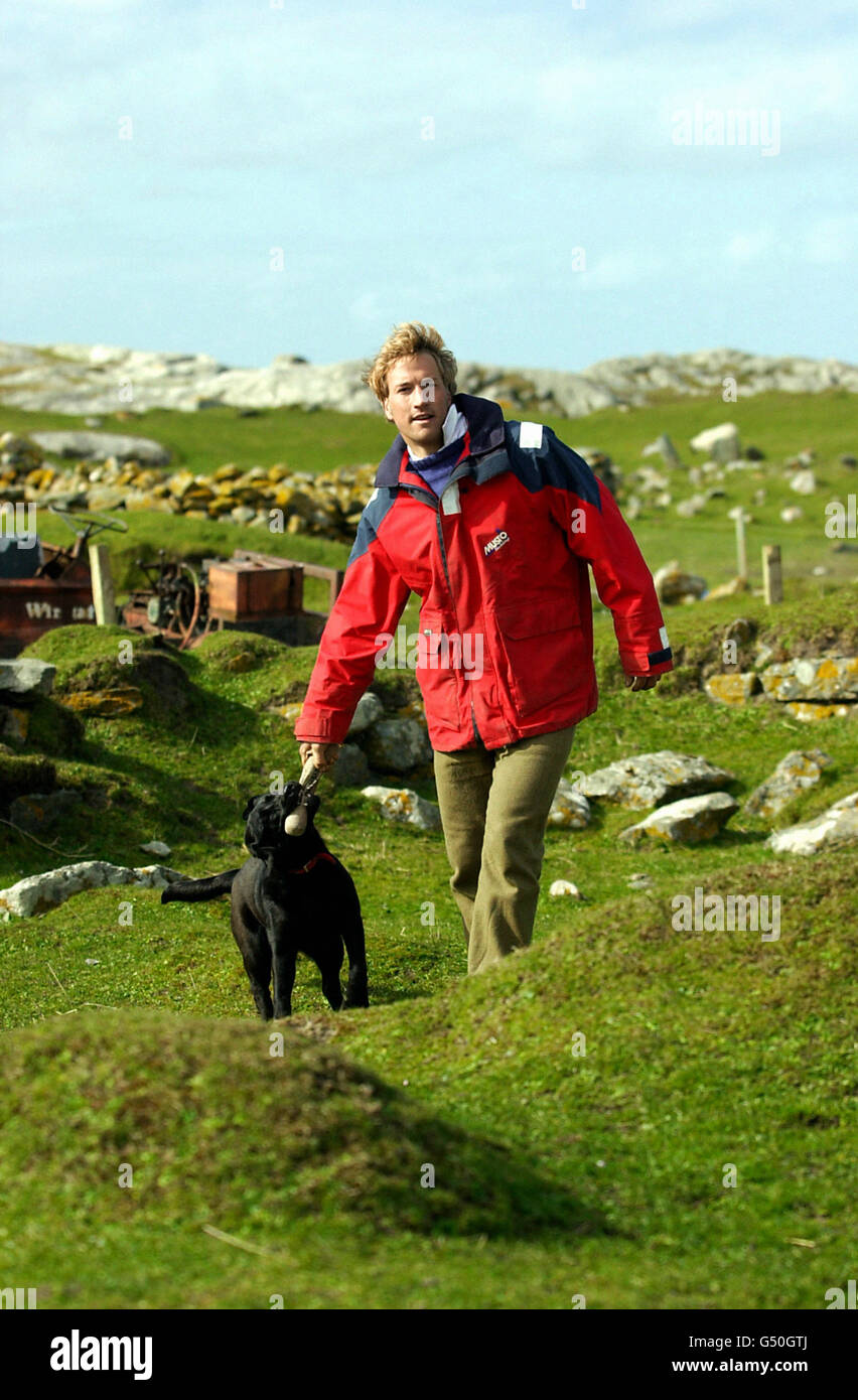 Castaway Benjamin Fogle takes his dog for a walk on the island of ...