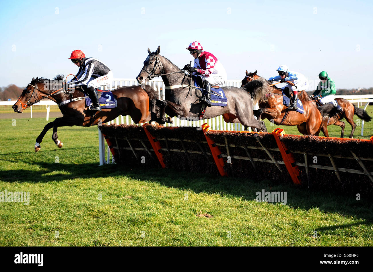 L-R: Jockey Noel Fehily on Dark And Dangerous leads from Paddy Brennan ...