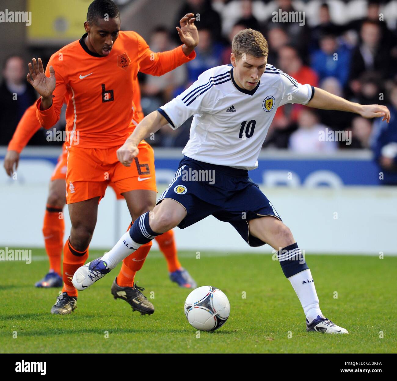 Holland's Leroy Fer challenges Scotland's David Wotherspoon during a ...
