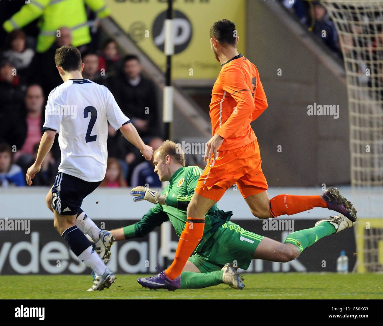 Scotland's Ryan Jack and Goalkeeper Mark Ridgers save from Holland's ...