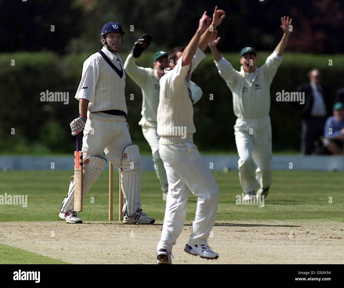 Scotland's Dene Hills awaits the umpire's decision after an ...