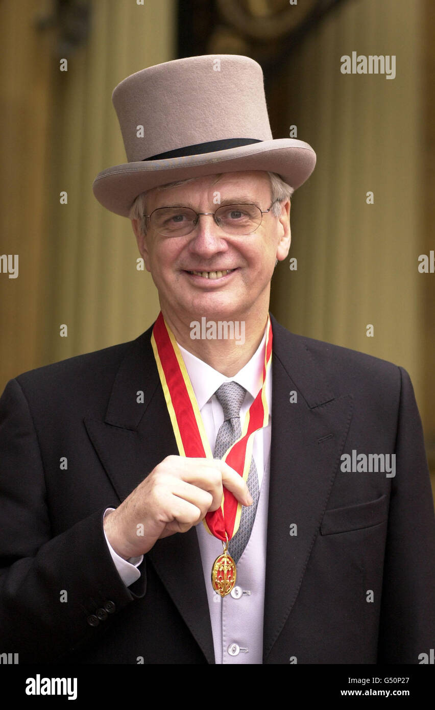 Sir Alistair Graham after he received an OBE during an Investiture ceremony held with Queen ...