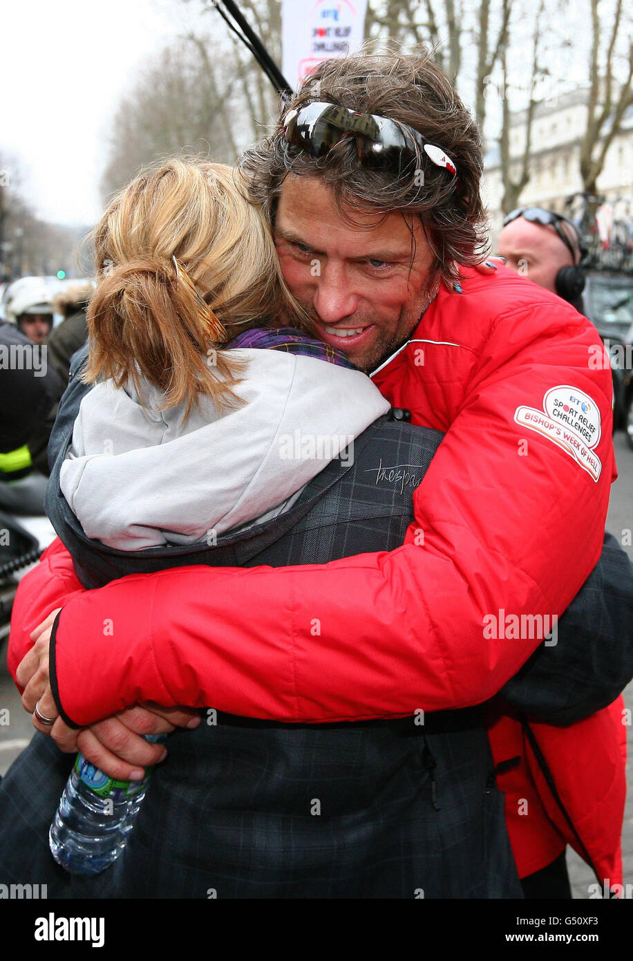 Comedian John Bishop gets a hug from wife Mel as he arrives in ...