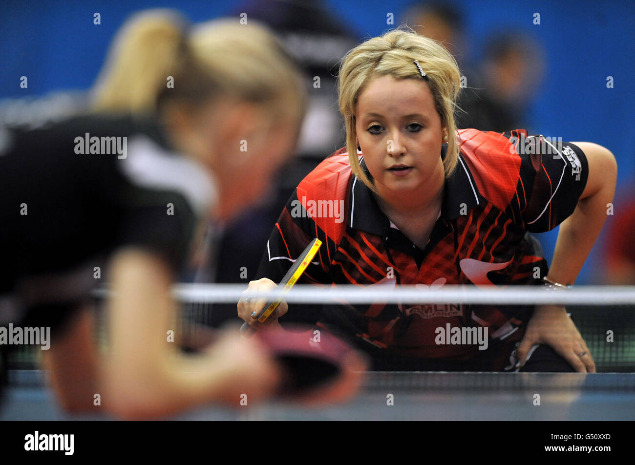 Emily Bates (right) prepares to receive serve from Isobel Ashley during ...