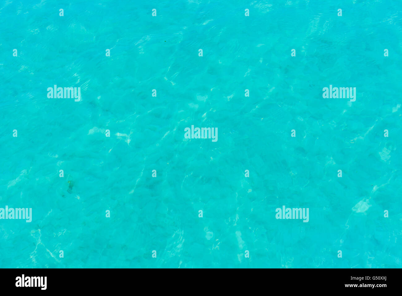 Transparent turquoise sea water with ripples background Stock Photo - Alamy