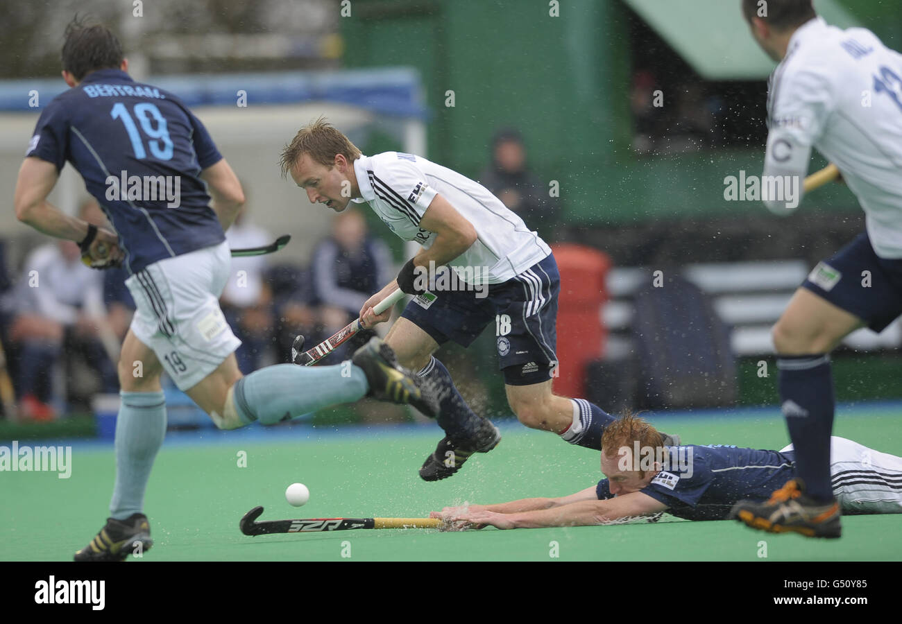 Reading's Harry Slater (ground) challenges East Grinstead's Barry ...