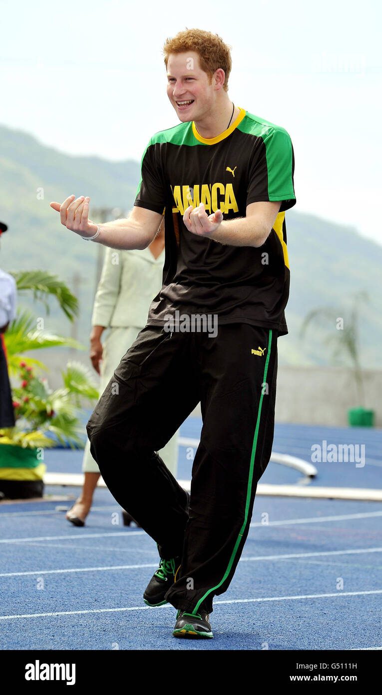 Prince Harry looks pleased after beating Olympic sprint champion Usain ...