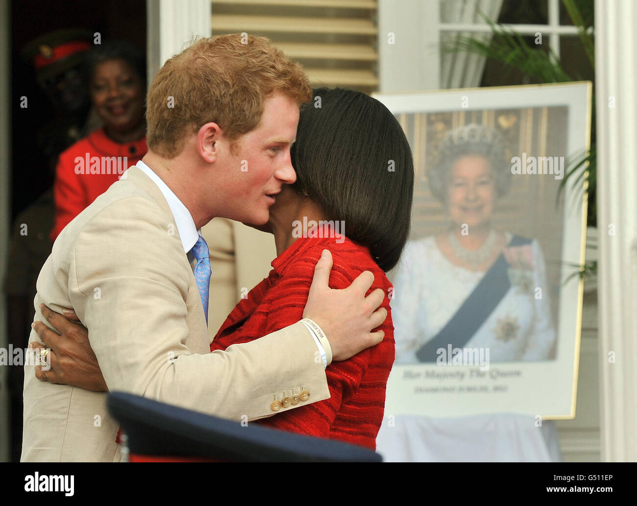 Prince Harry embraces the Prime Minister of Jamaica Portia Simpson ...