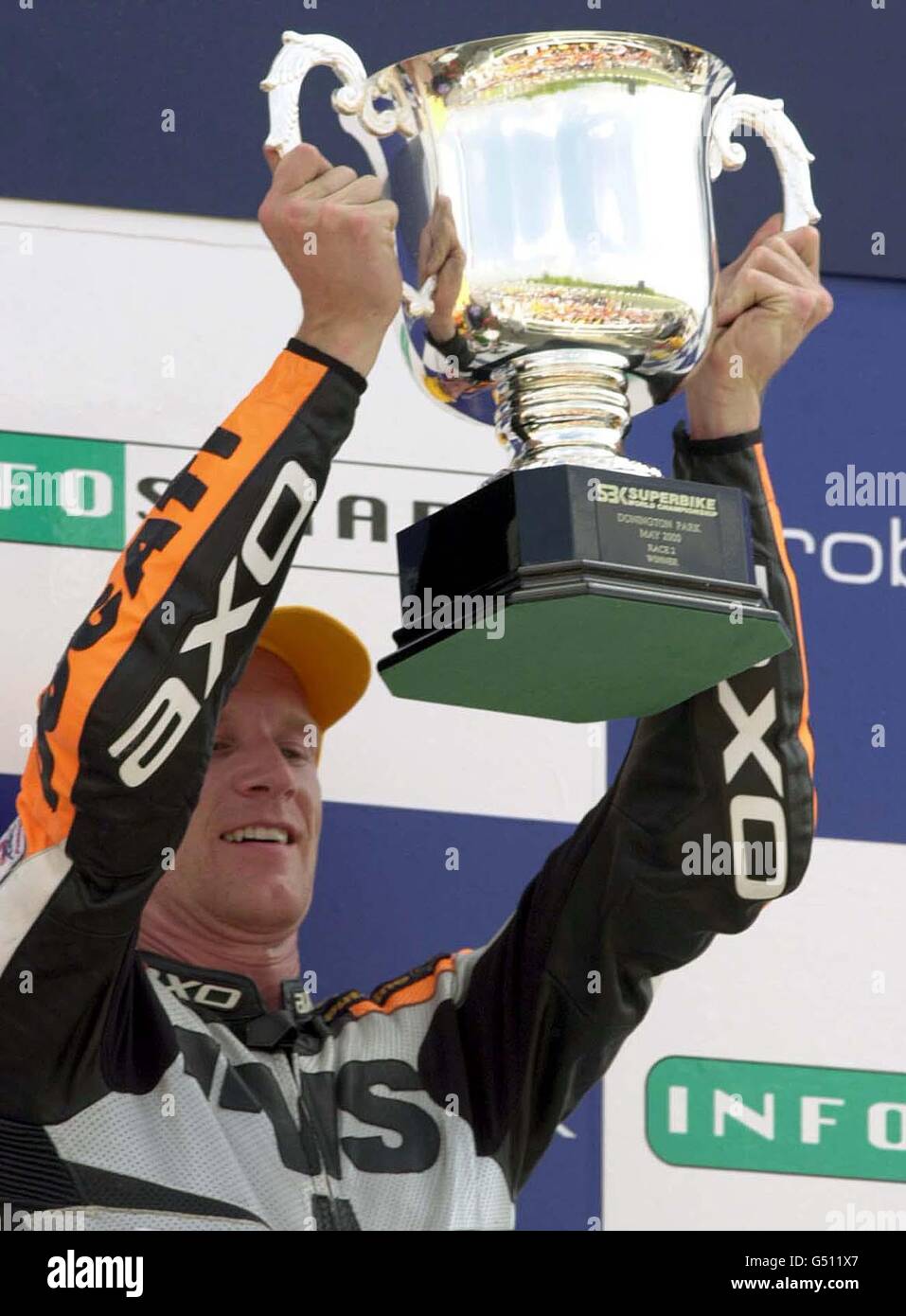 Great Britain's Neil Hodgson lifts the trophy after winning race two of ...