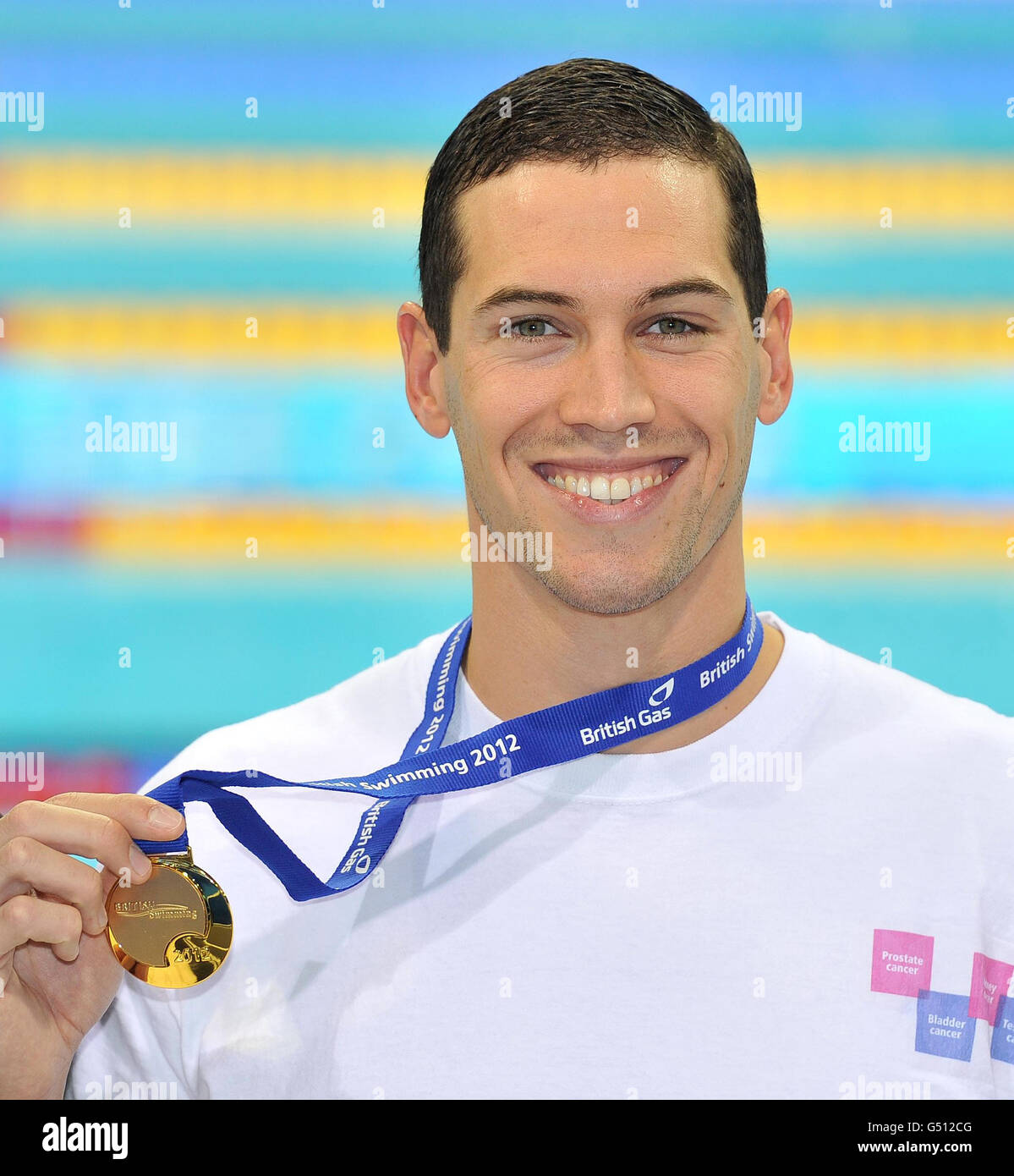 Simon Burnett with his gold medal after winning the final of the Men's ...
