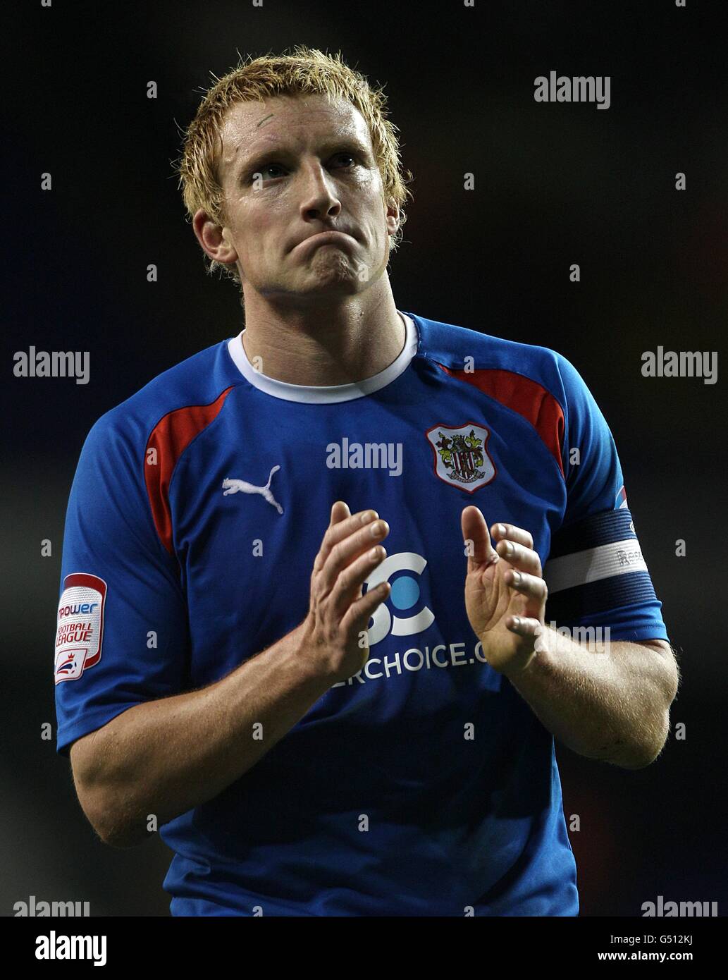 Stevenage captain Mark Roberts applauds the fans after the game Stock ...