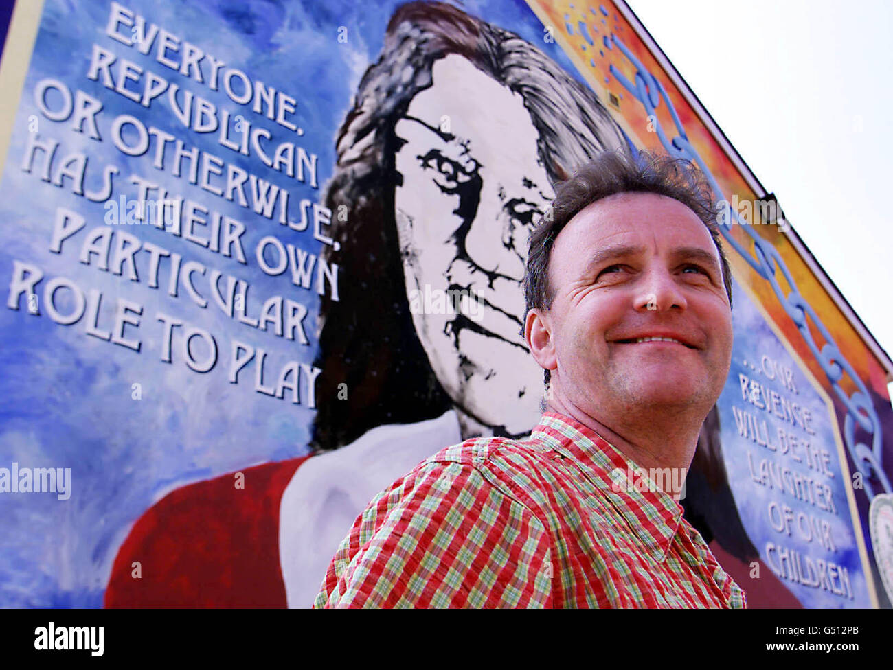 Sinn Fein's behind-the-scenes strategist Jim Gibney beside a new mural ...