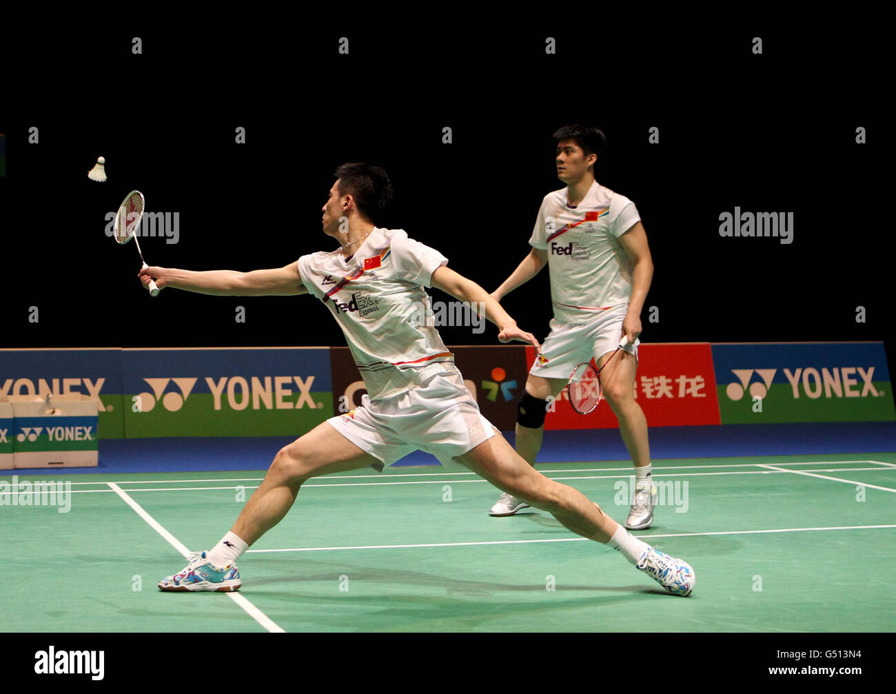 China's Cai Yun returns a shot watched by his partner Fu Haifeng during ...