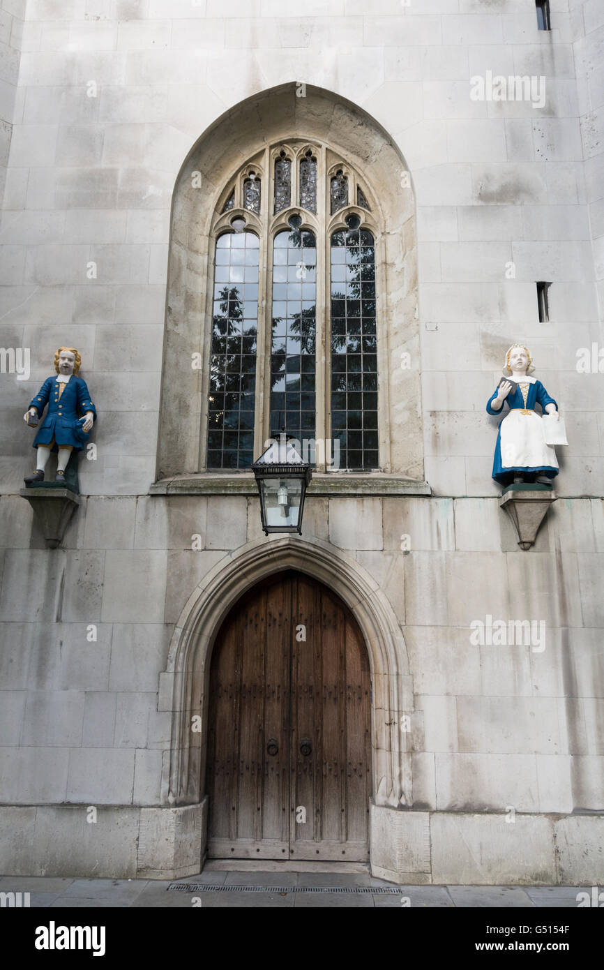 St Andrew Church Holborn - Statue of Blue Coat orphans holding the Holy ...