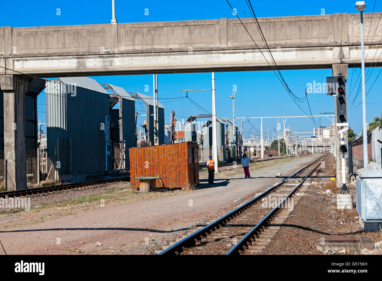 Two security guards under bridge outside train station in Durban, South ...