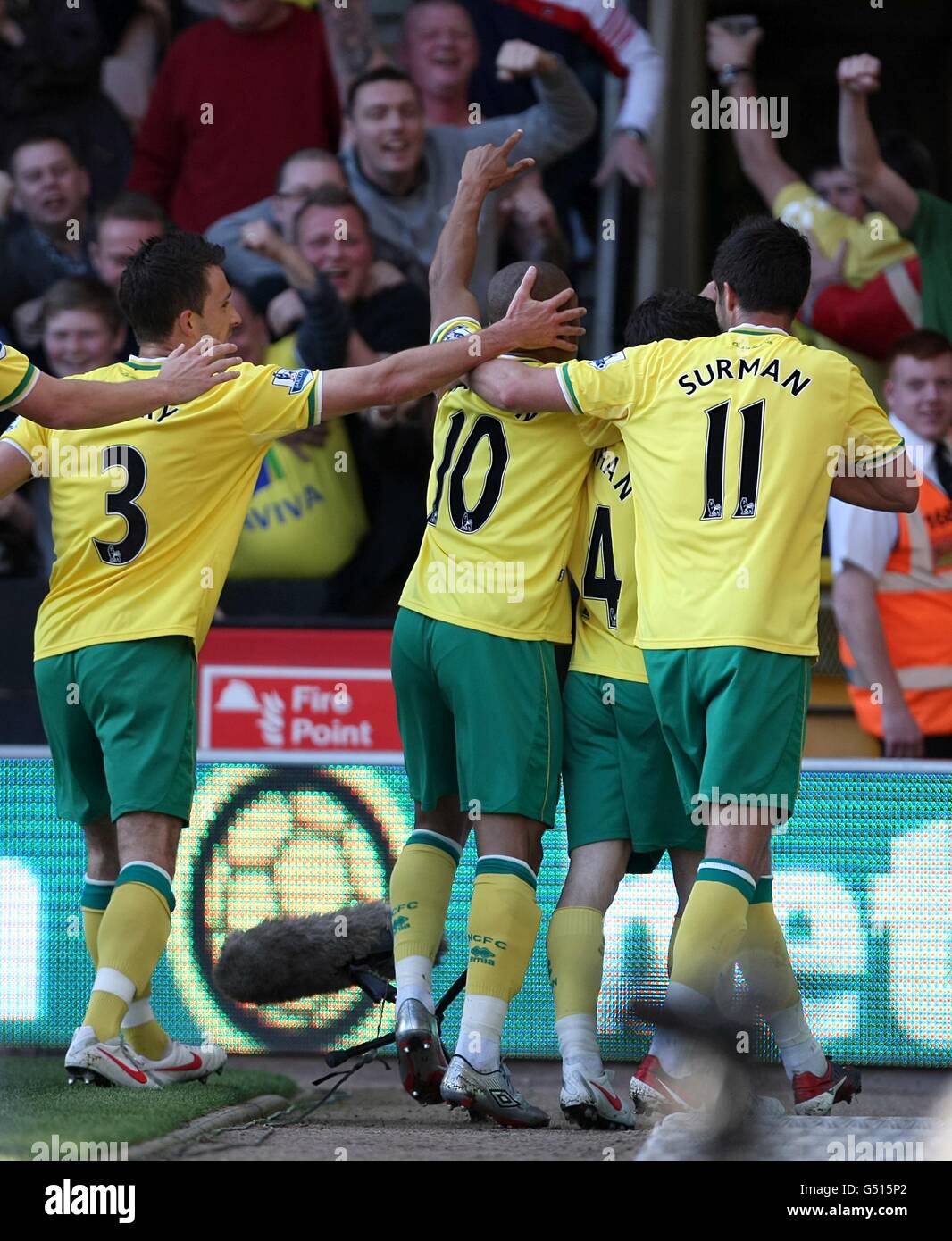 Norwich City's Wesley Hoolahan (obscured) celebrates with team-mates ...