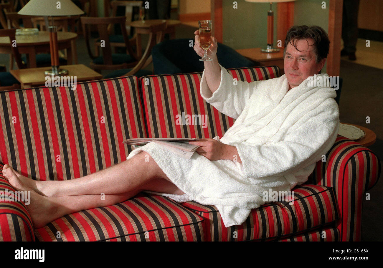 Relaxes in the new british airways lounge at heathrow airport hi-res ...