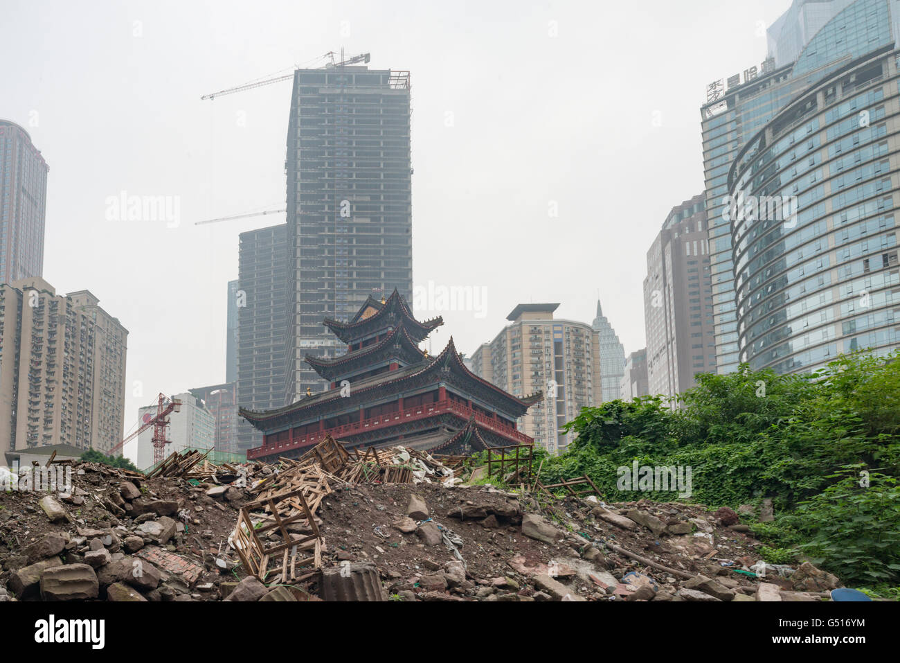 China, Chongqing, Arhat Temple amidst skyscrapers in the background ...