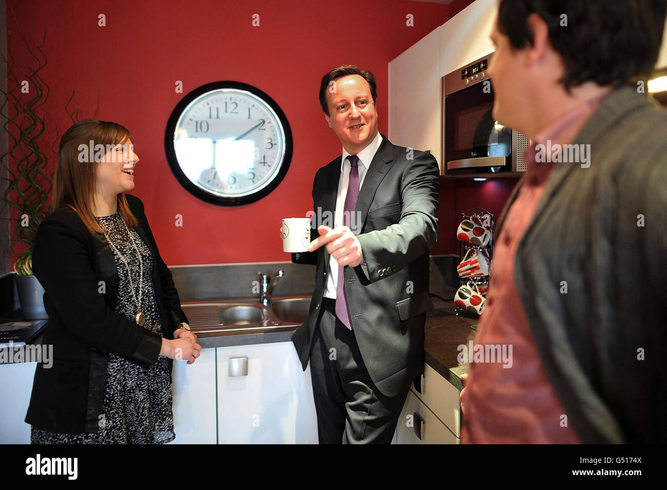 Prime Minister David Cameron speaks to a young couple, Lianne Cowdry ...