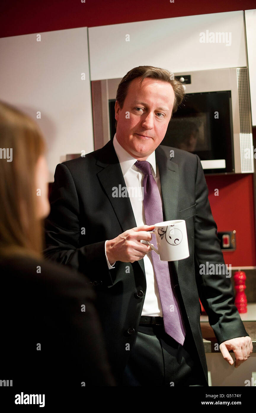 Prime Minister David Cameron speaks to Lianne Cowdry , 27, during a ...