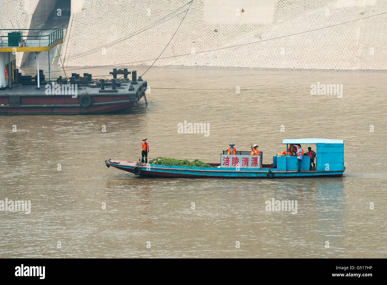 China, Chongqing, Small traditional wooden boat on the Yangtze River ...