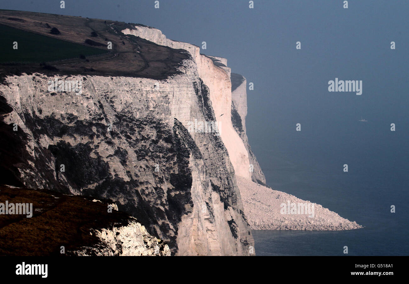 A view a pile of rocks left on the beach between Langdon Cliffs and ...