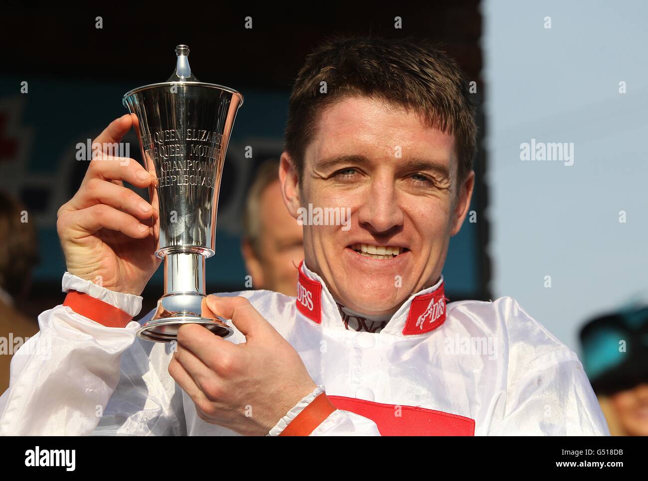 Jockey Barry Geraghty with the trophy after winning the sportingbet.com ...