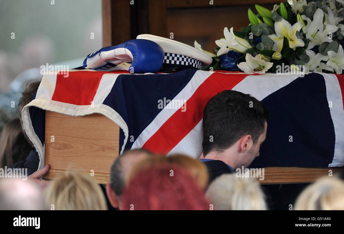 The coffin of Pc David Rathband is carried into Stafford Crematorium at ...