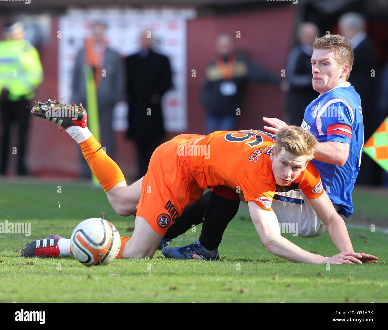 Rangers's Seven Davis challenges Dundee United's Stuart Armstrong ...