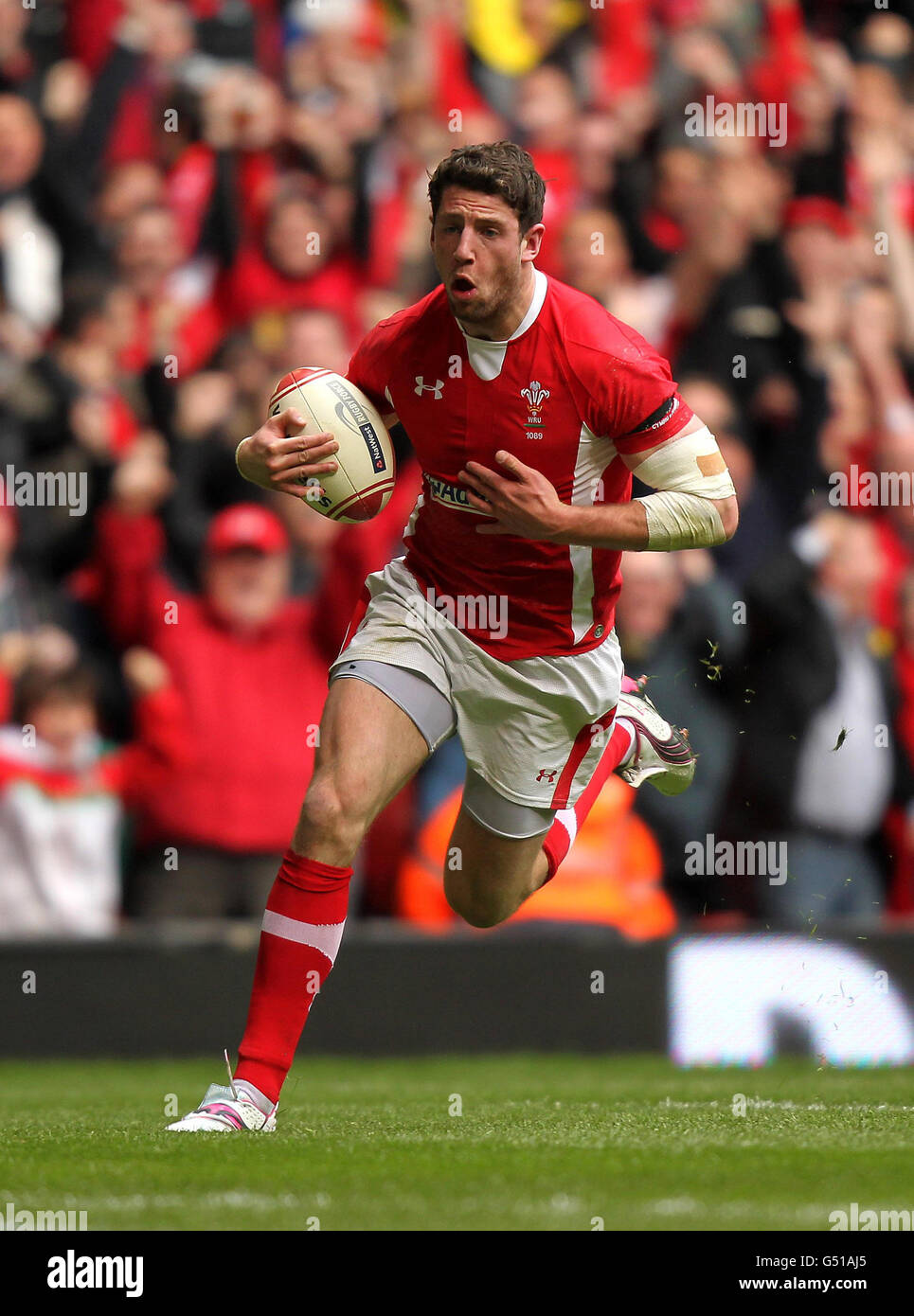 Wales' Alex Cuthbert runs in to score the opening try during the RBS 6 ...